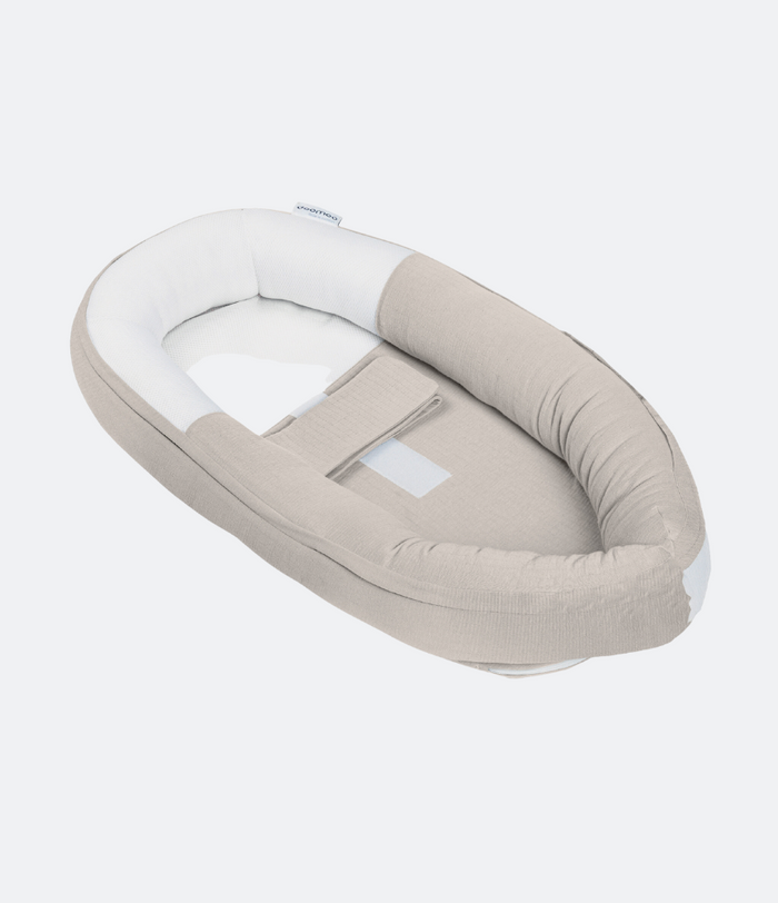 Réducteur de lit doomoo Cocon pour éveil de bébé Confort | Babymoov®